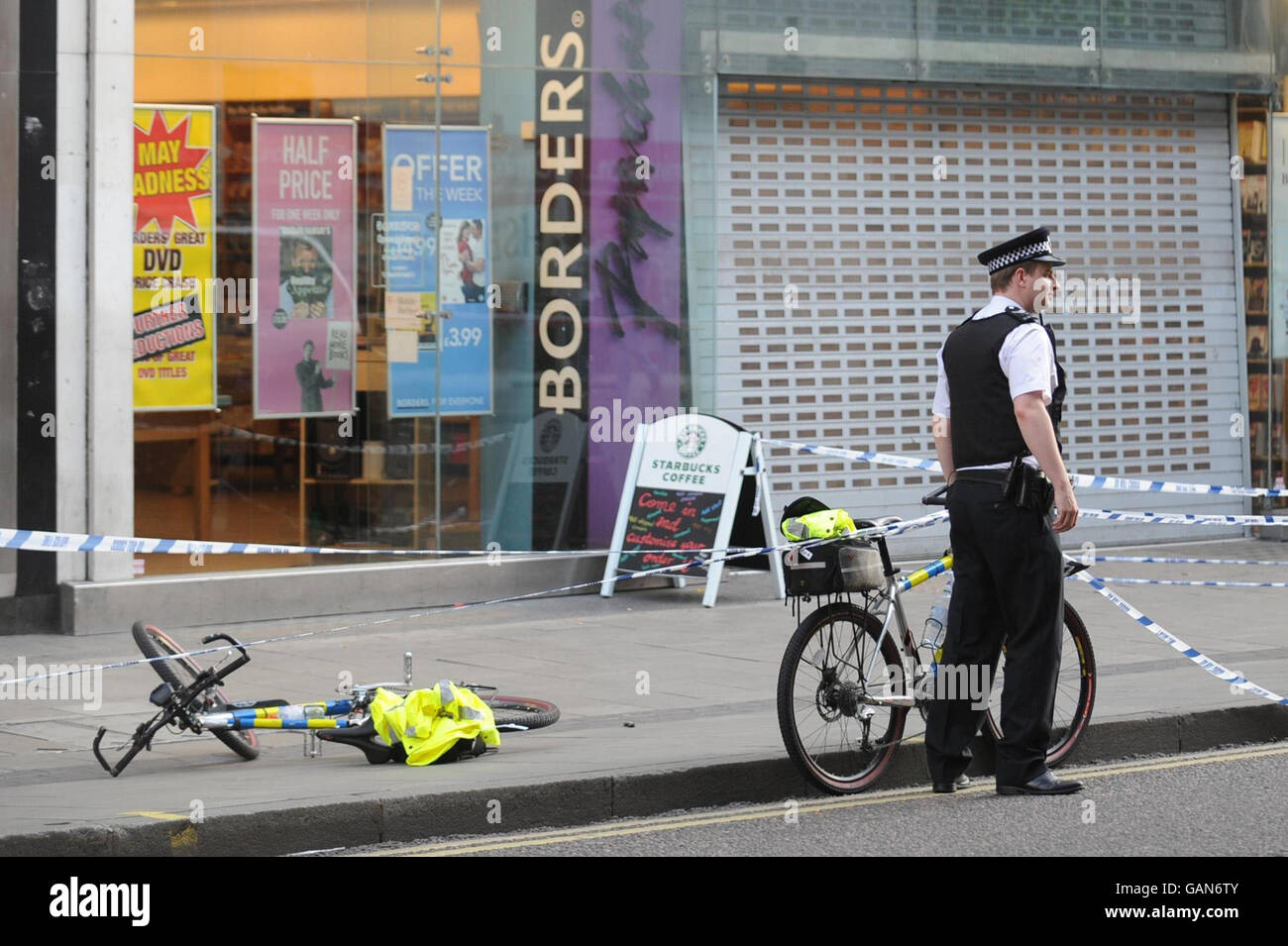 A police officer attends scene on londons oxford street hi-res stock ...