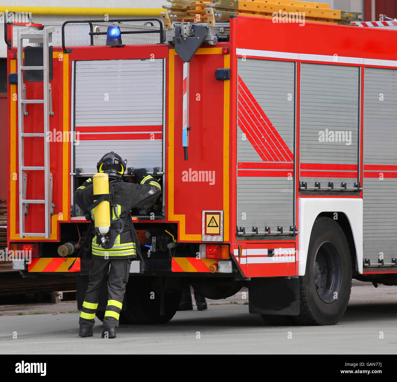 Firefighter during a training exercise with the oxygen cylinder and the ...