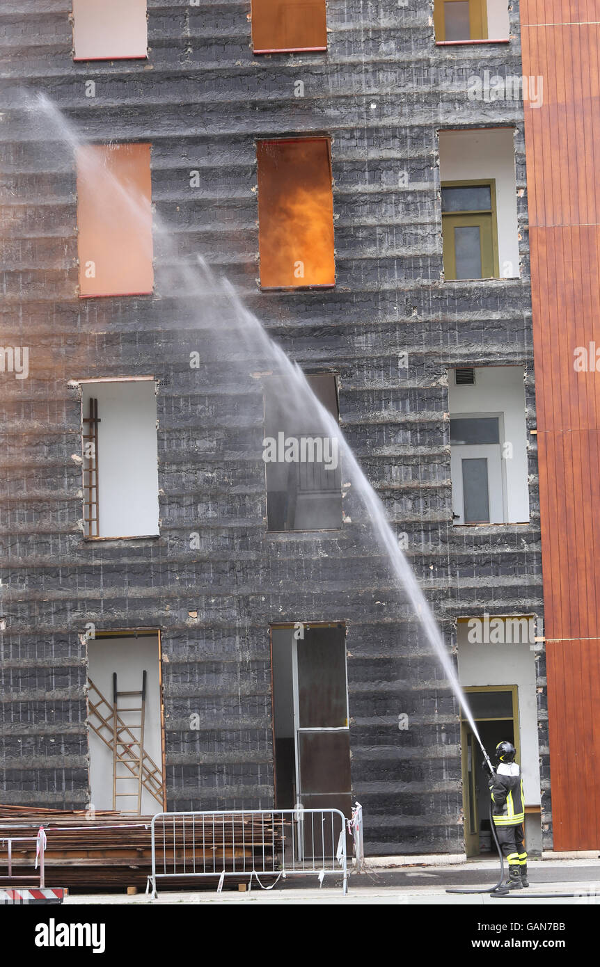 firefighters with fire during practice in the firehouse Stock Photo - Alamy