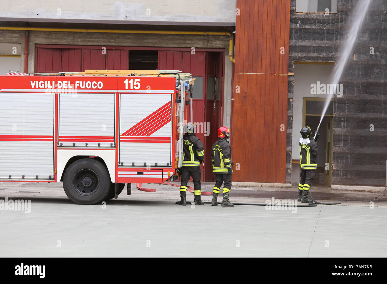 italian fire engine pulled up in front of the blazing building Stock ...