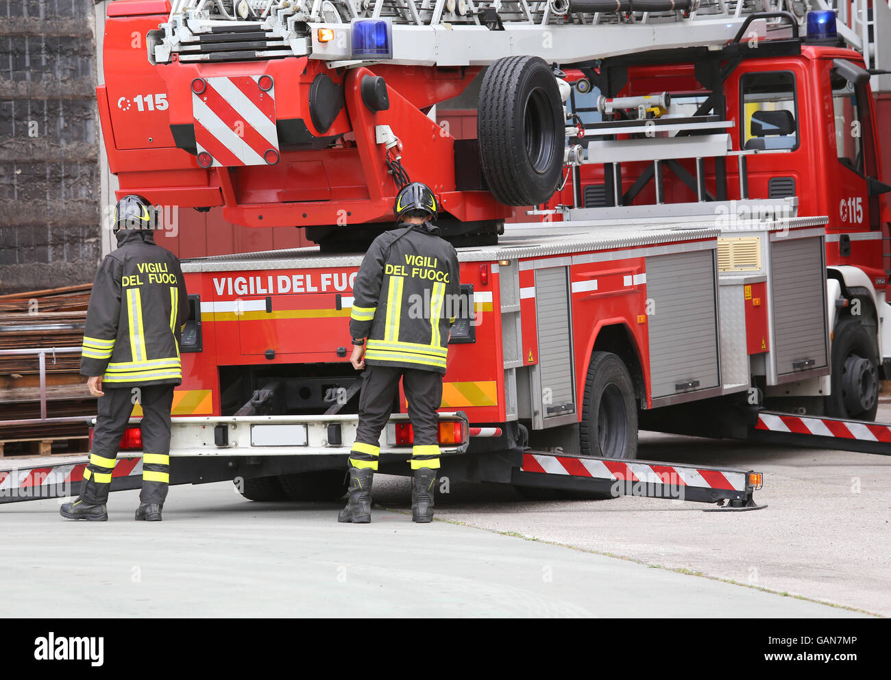 Italian fire engine pulled up in front of the blazing building Stock ...