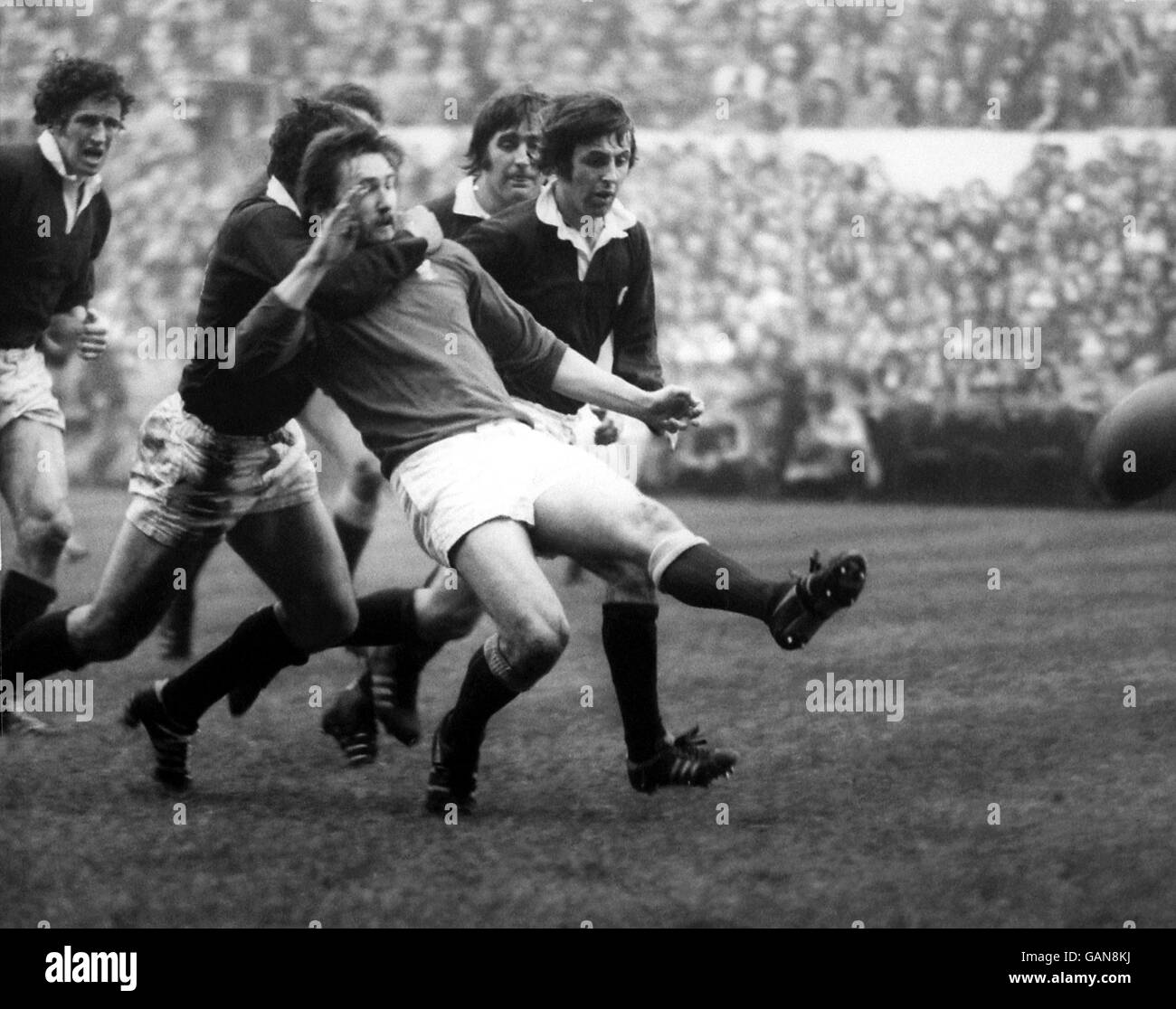Scotland's Alastair Cranston (second l) grabs Wales' Ray Gravell ...
