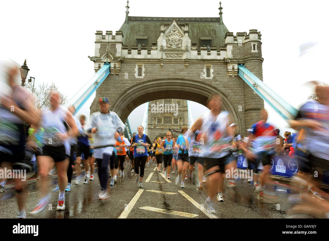 Runners cross Tower Bridge during the London Marathon 2008 Stock Photo ...