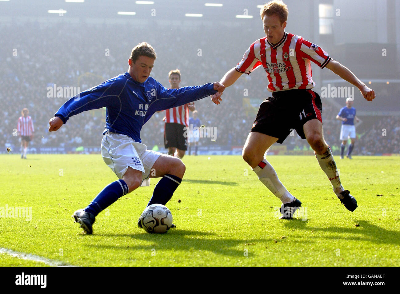 Everton's Wayne Rooney (l) takes on Southampton's Michael Svensson ...