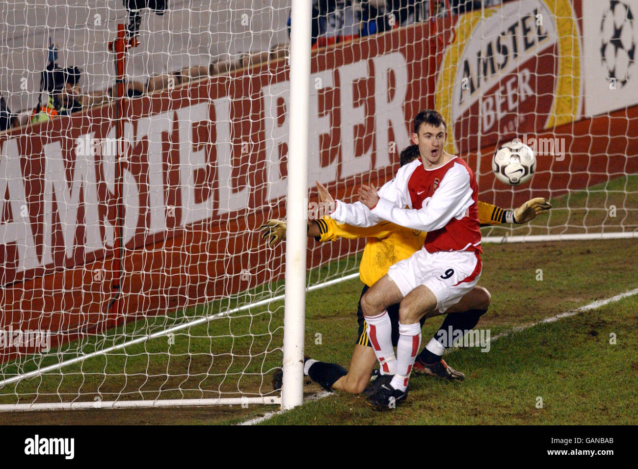 Arsenal's Francis Jeffers (front) and Ajax's goalkeeper Bogdan Lobont ...