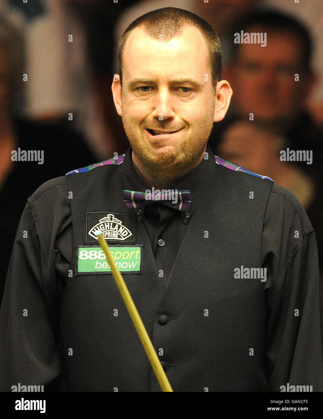 Mark Williams studies the table during his first round match against ...