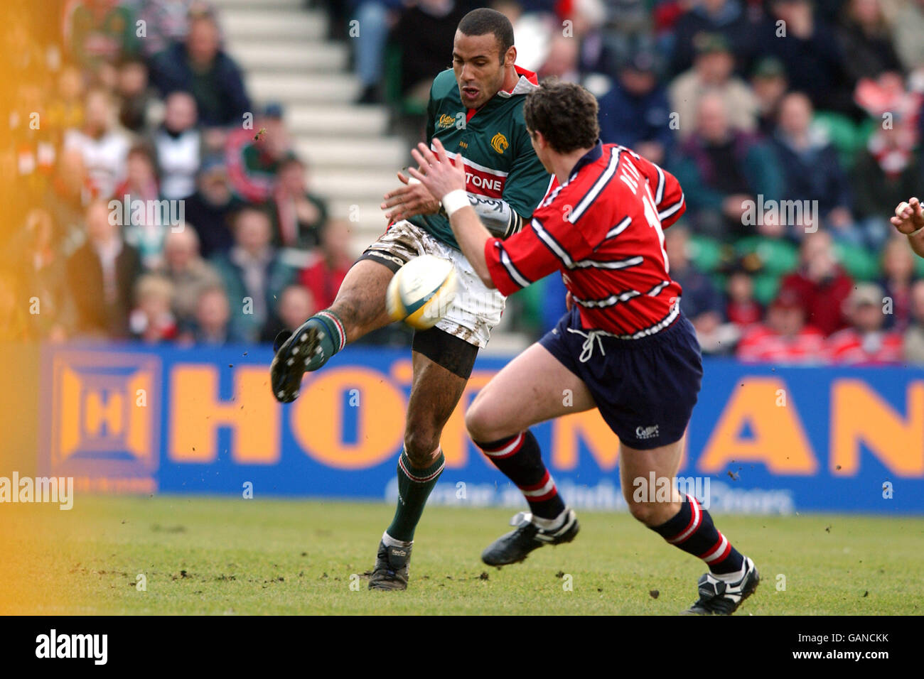 Leicester Tigers' Leon Llyod (l) is closed down by Gloucester's Tom ...