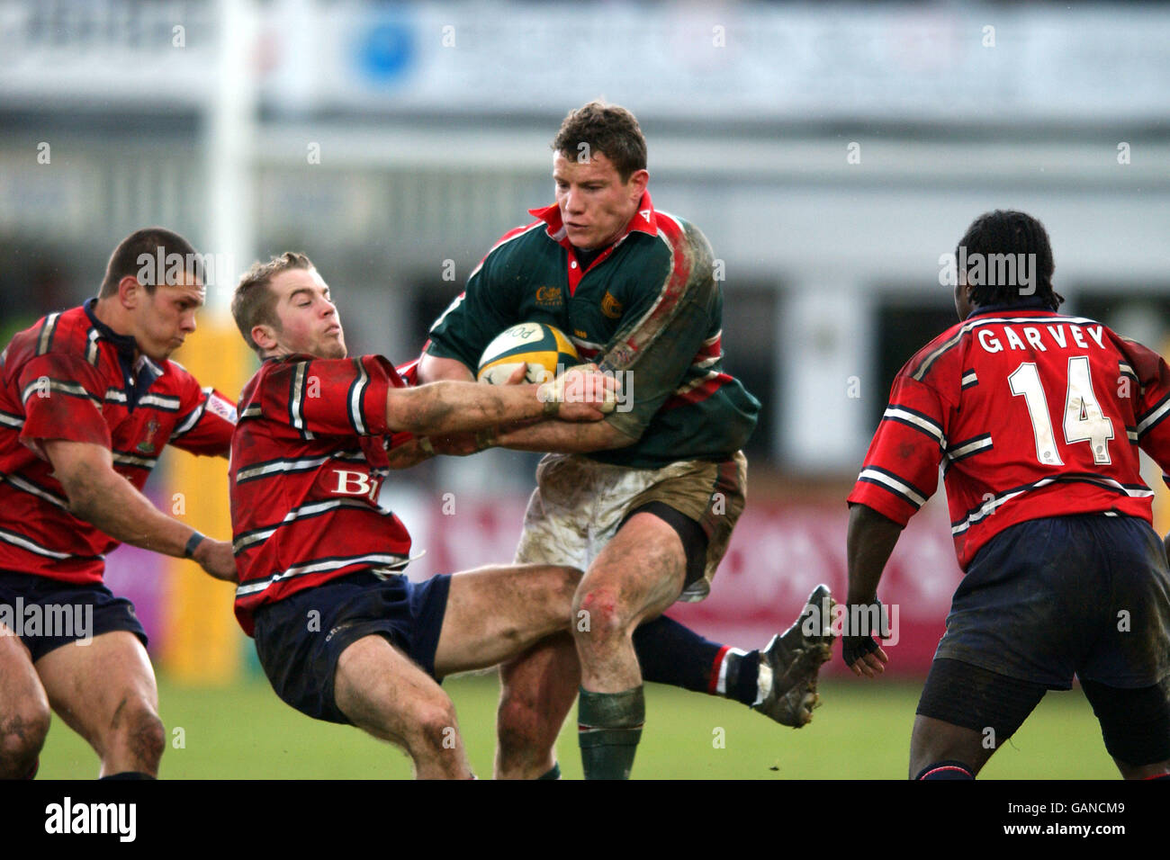 Leicester Tigers' Tim Stimpson is tackled by Gloucester's James Simpson ...