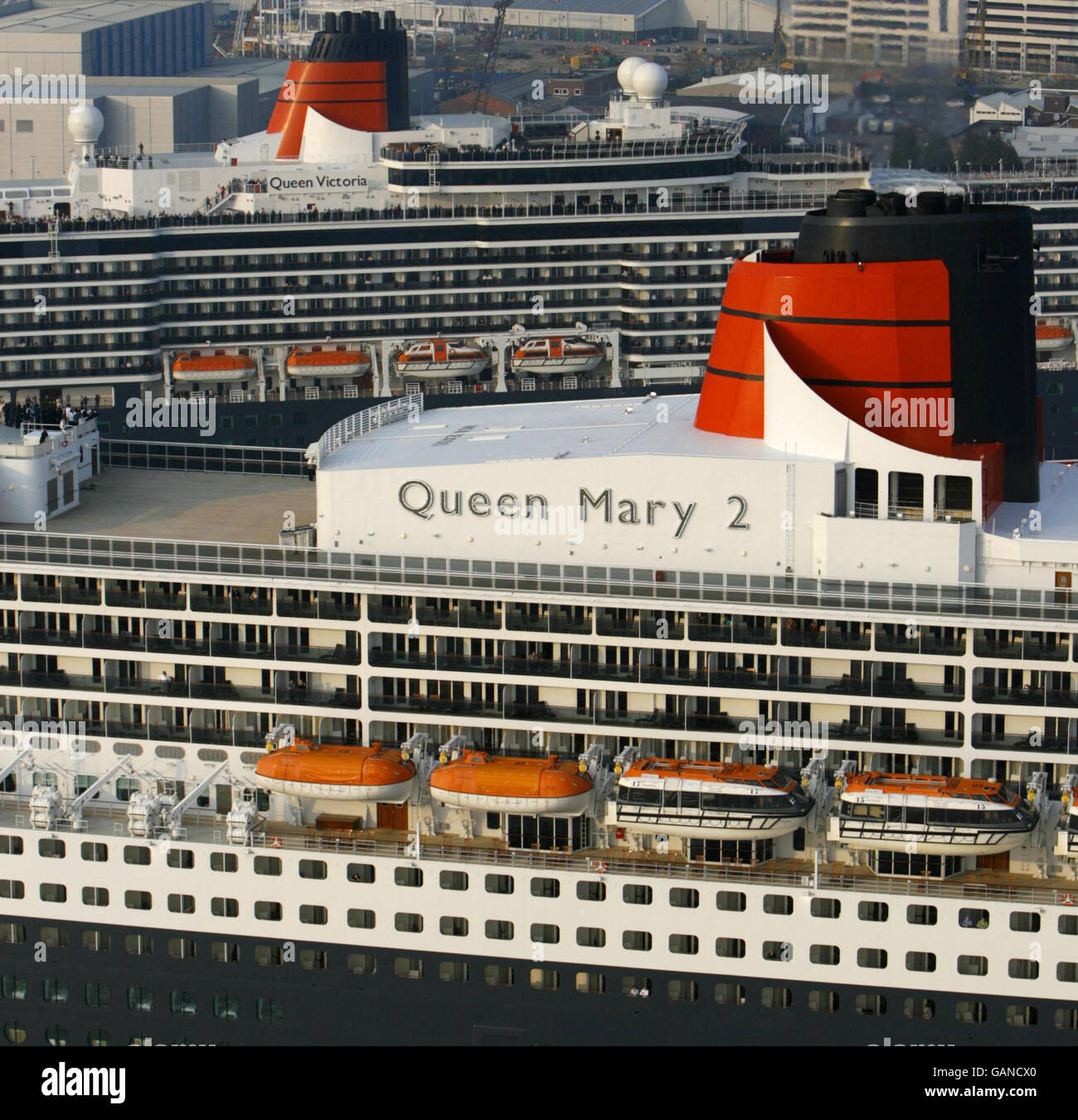 Queen Mary II (nearest camera) steams past the other two liners in the ...