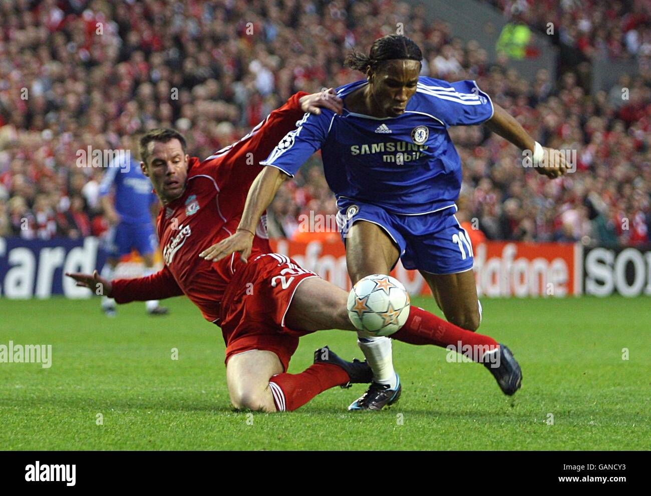 Chelsea's Didier Drogba and Liverpool's Jamie Carragher battle for the ...