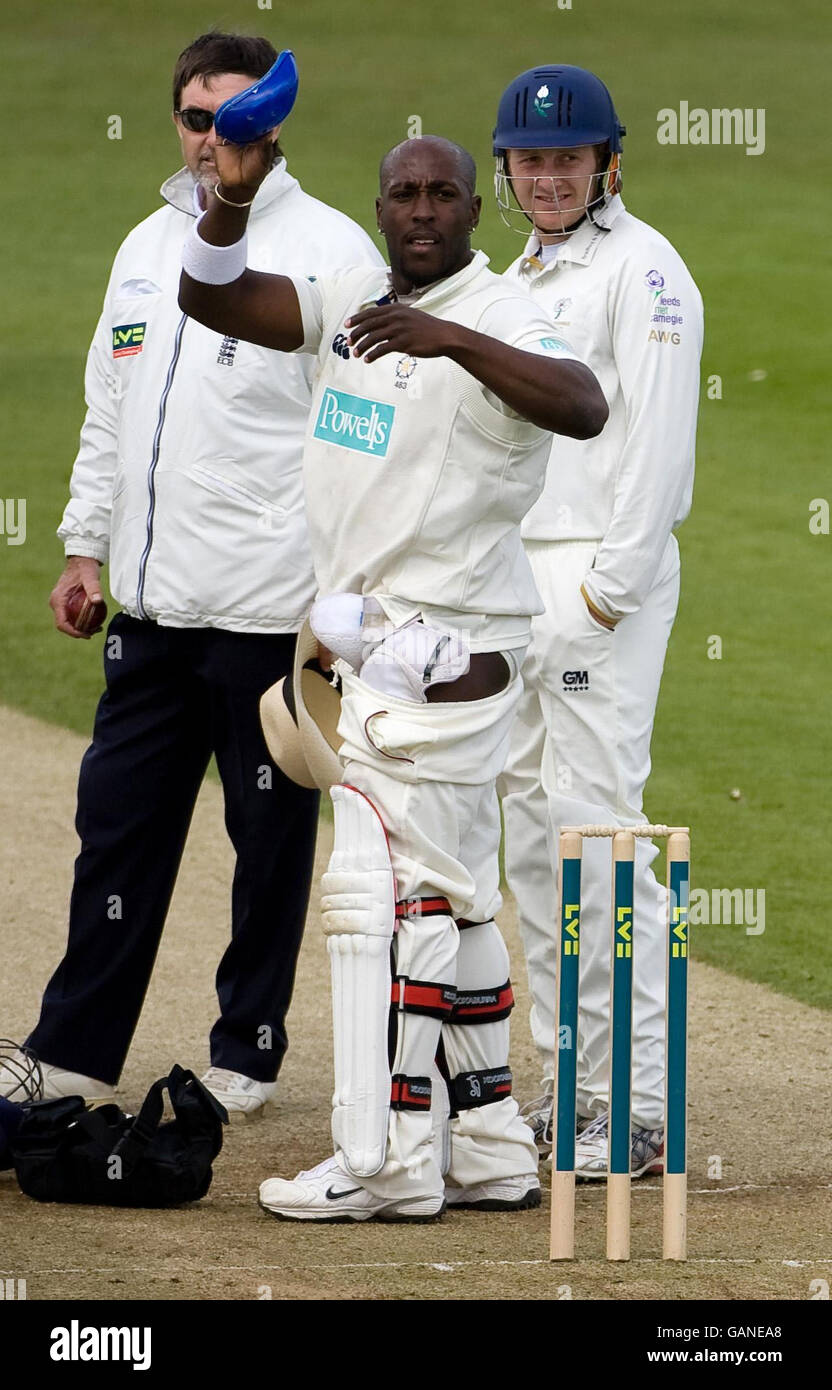 Hampshire's Michael Carberry replaces his box after hitting been hit by ...