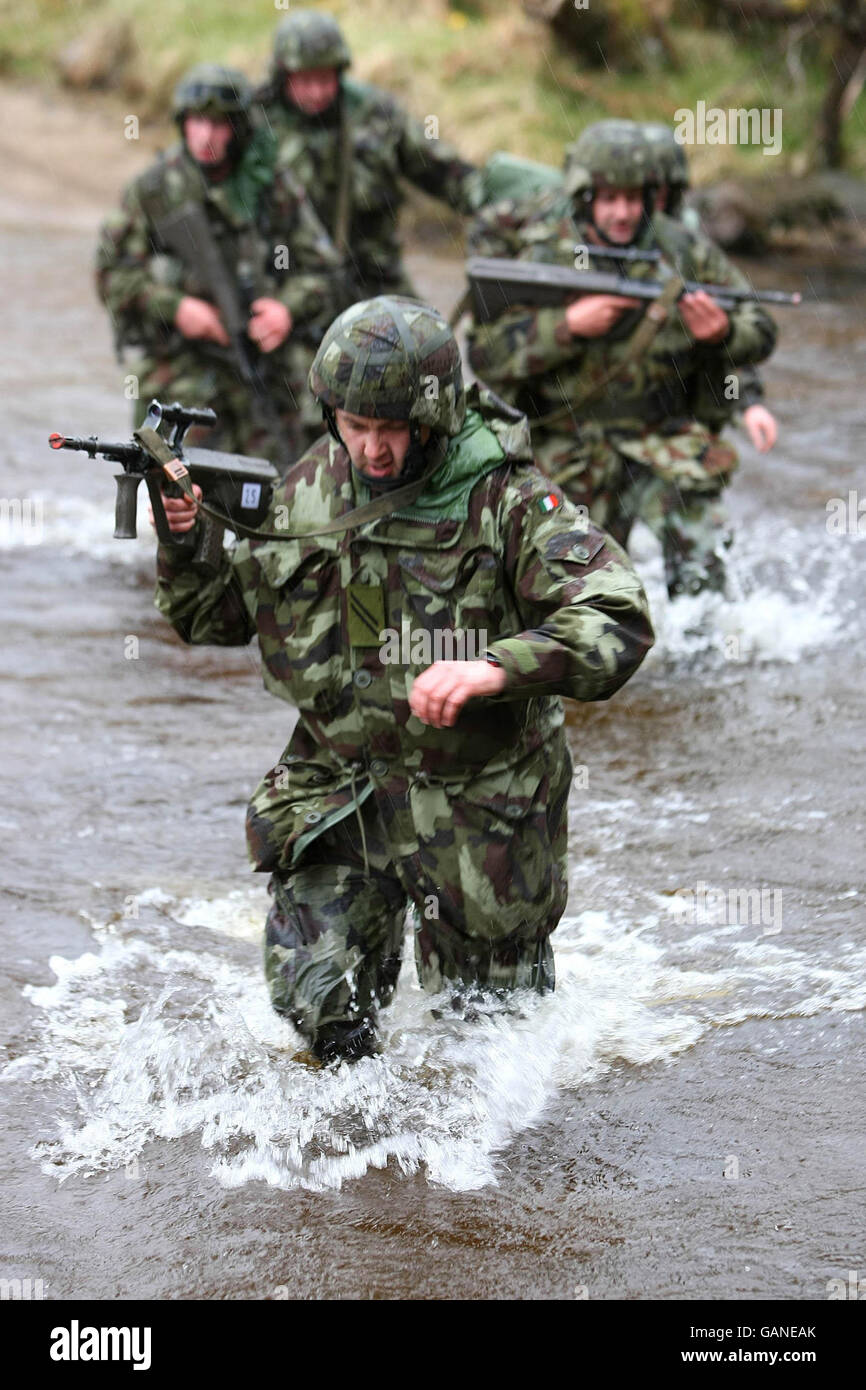 Members of the Irish Defence Forces take part in a full military ...