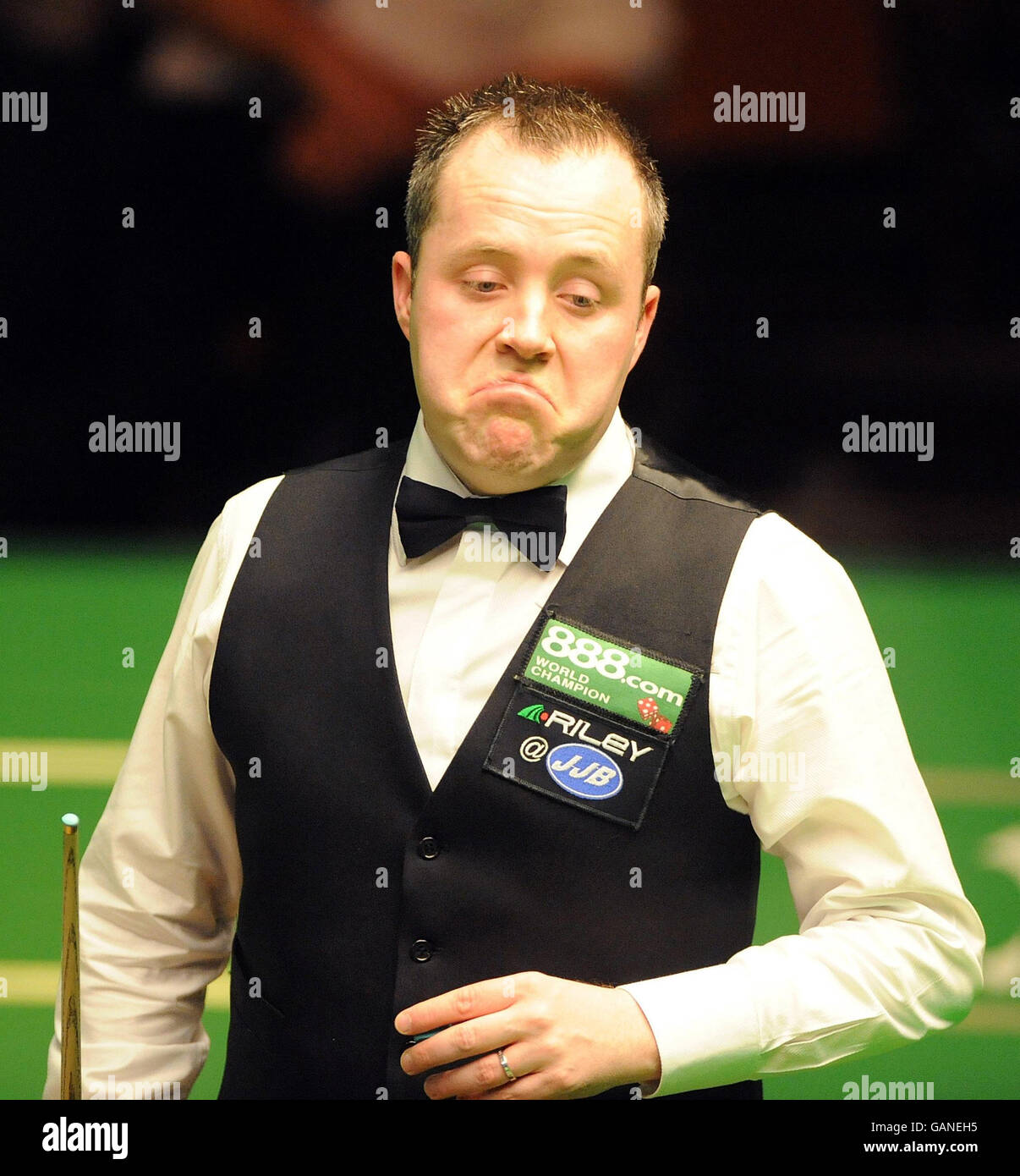 John Higgins studies the table during his second round match against ...