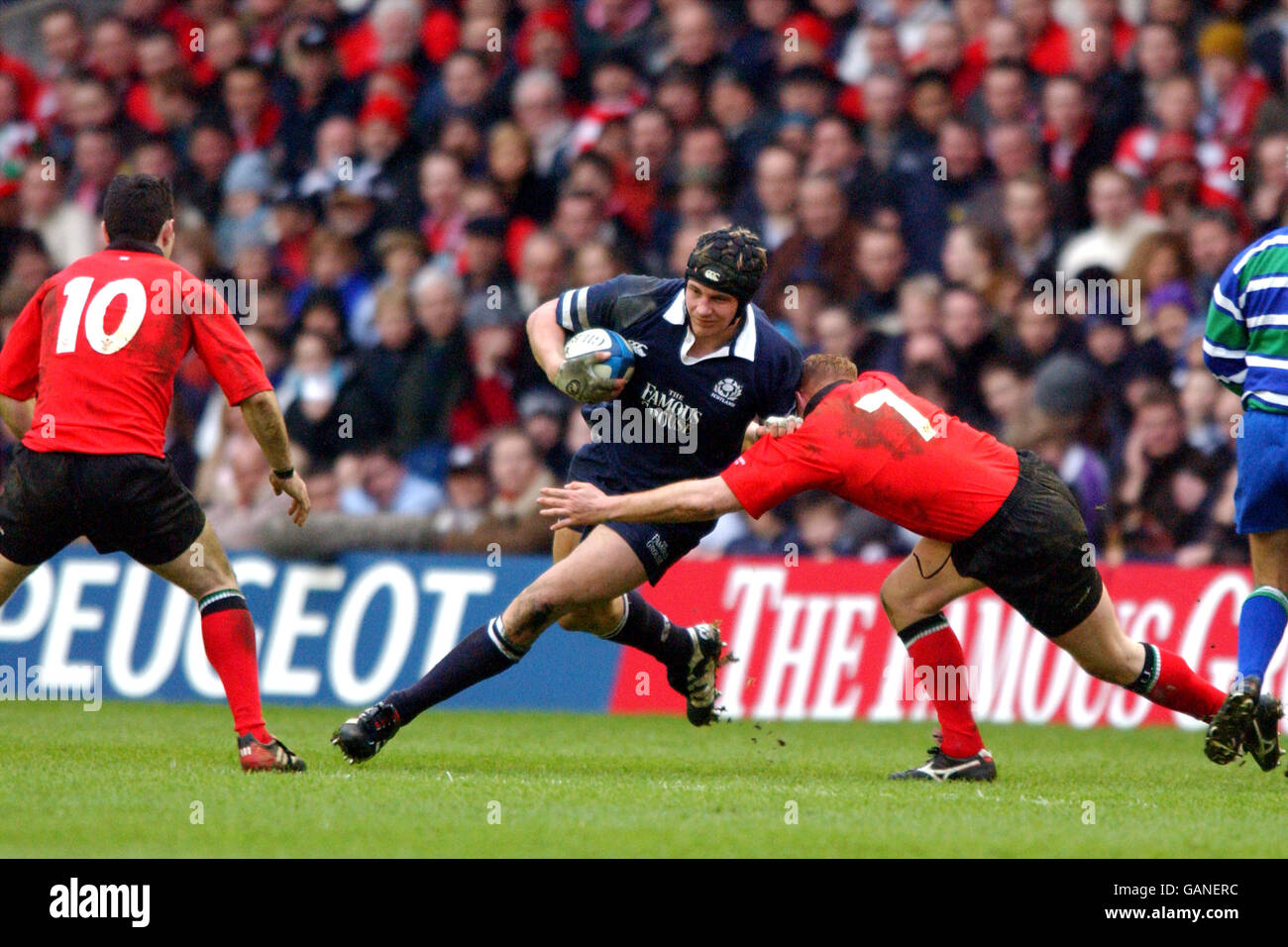 Scotland's Stuart Grimes (c) is challenged for the ball by Wales ...