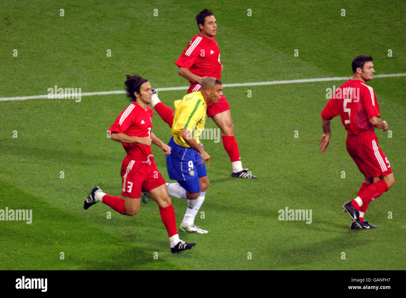 Brazils ronaldo dribbles through the turkish defence hi-res stock ...