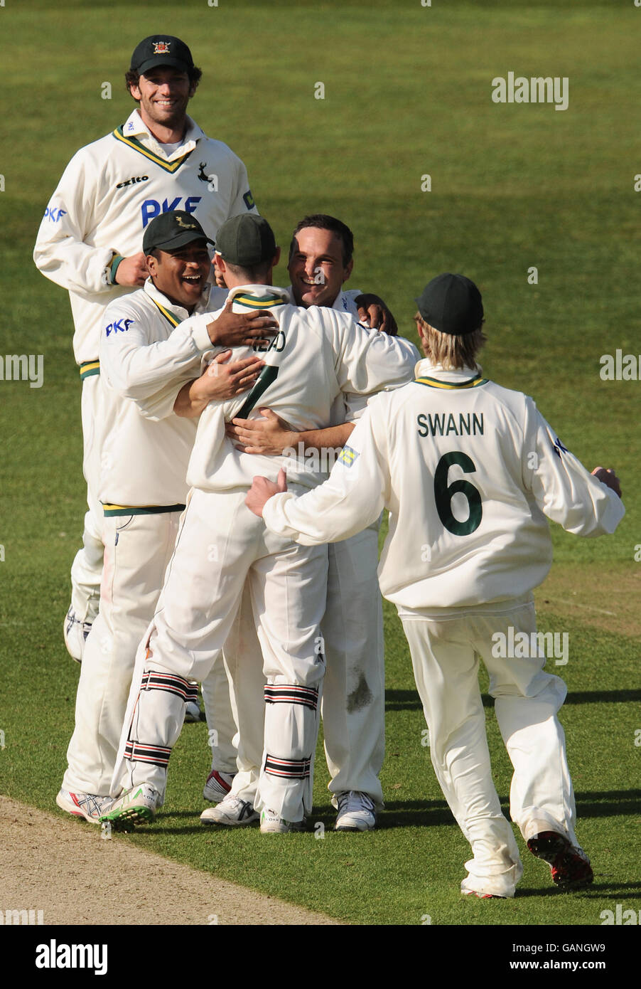 Nottinghamshire's Mark Ealham congratulates wicketkeeper Chris Read ...