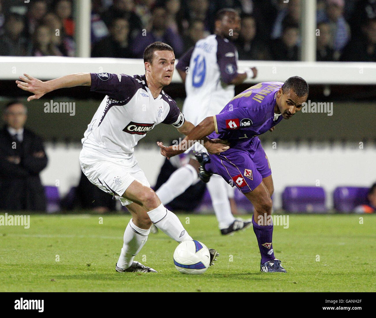 Rangers Barry Ferguson shields the ball from Fiorentina's Fabio ...