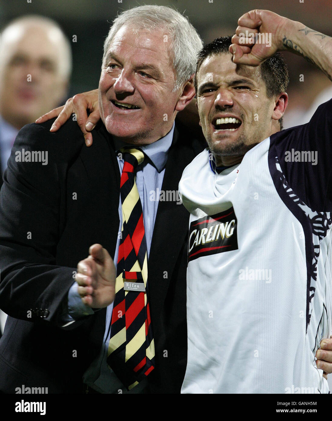 Rangers Nacho Novo celebrates with manager Walter Smith after the UEFA ...