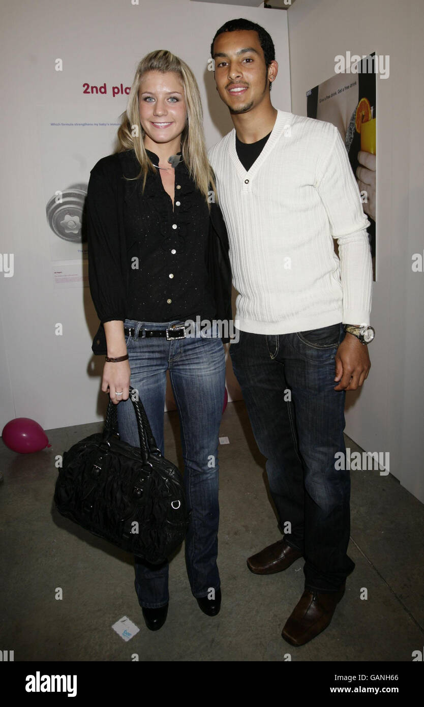Theo Walcott with girlfriend Melanie Slade attend the launch of 'Get ...