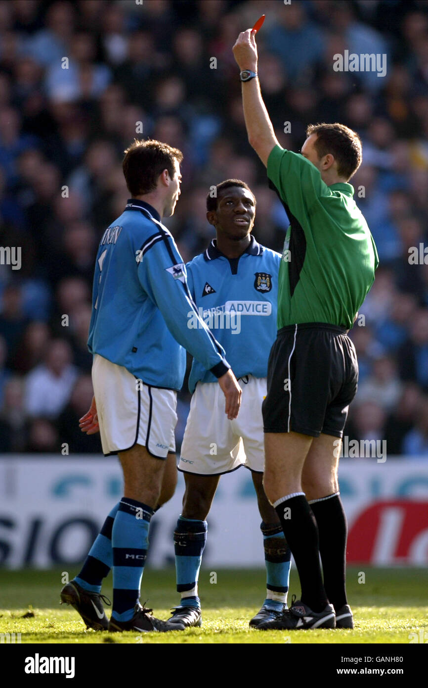 Manchester City's Niclas Jensen is shown the red card by referee Matt ...