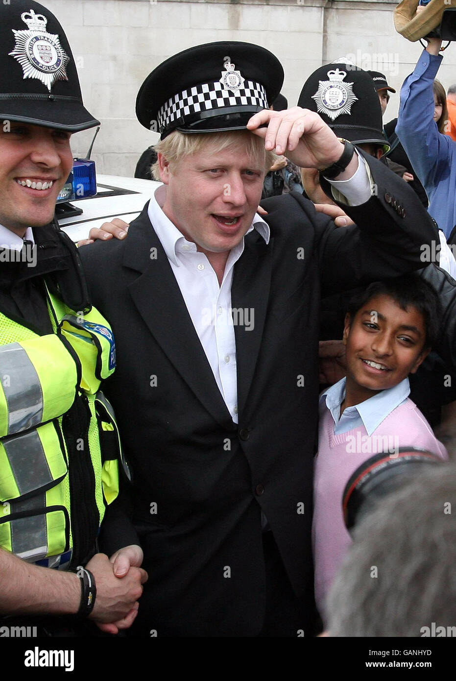 Newly elected London Mayor Boris Johnson wears a policeman's hat in ...