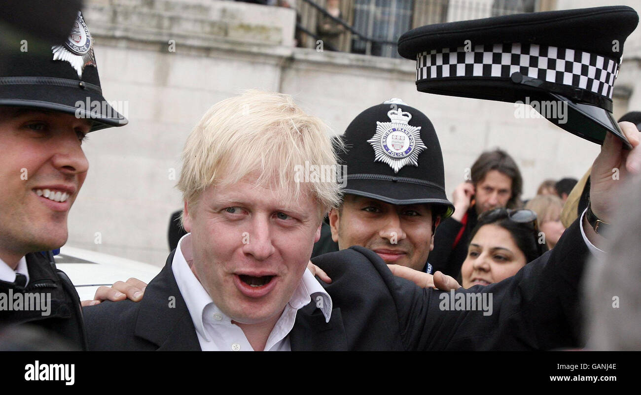 Newly elected London Mayor Boris Johnson wears a policeman's hat in ...
