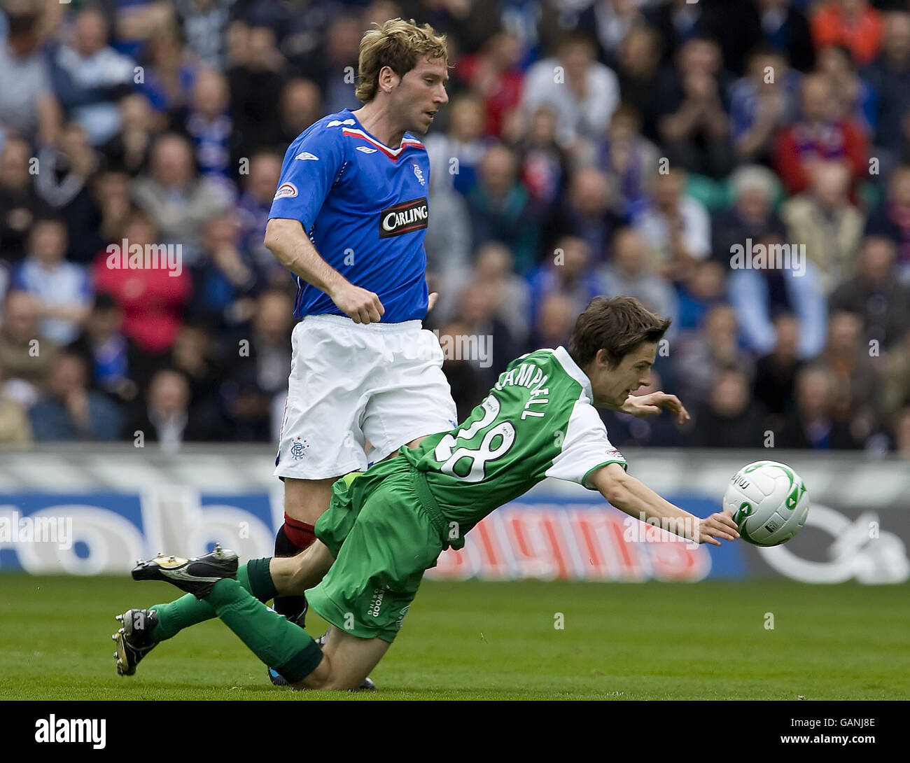 Rangers' Kirk Broadfoot tackles Hibernian's Ross Campbell during the ...