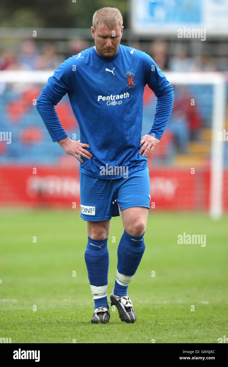 Bangor City's Peter Hoy leaves the field after being shown the red card ...