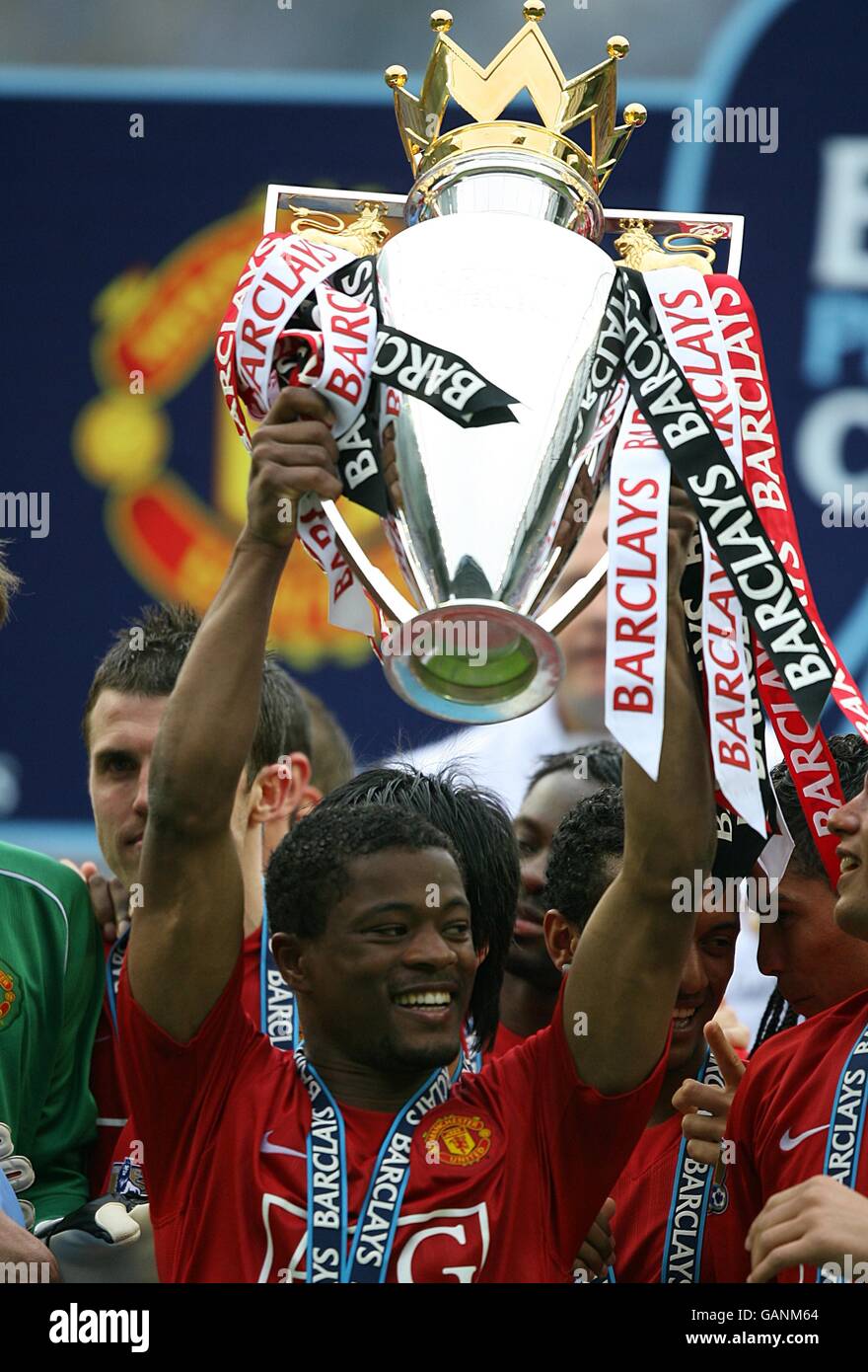 Manchester uniteds patrice evra lifts the premier league trophy hi-res stock photography and ...