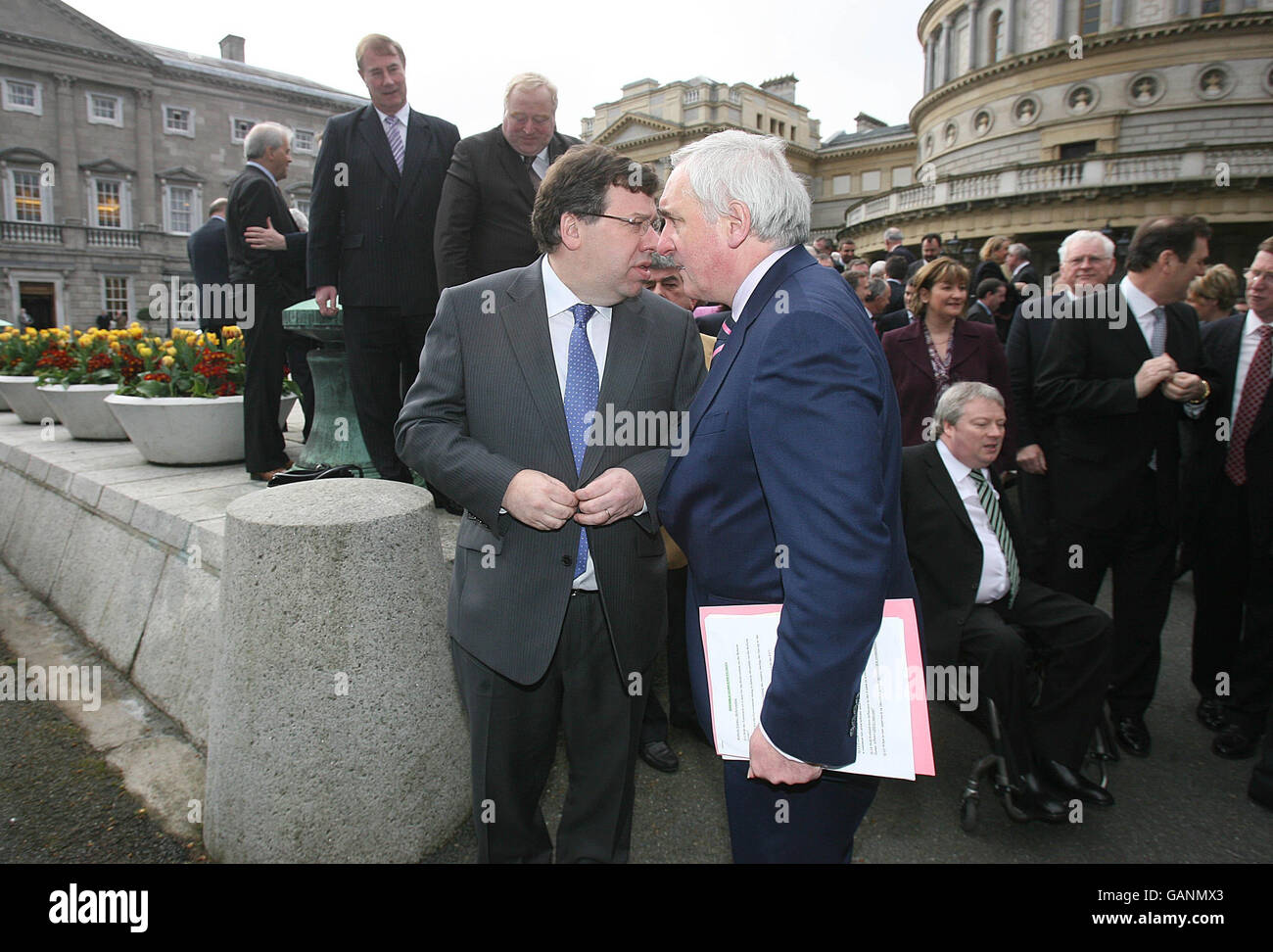Outgoing Taoiseach Bertie Ahern speaks with his replacement Brian Cowen ...