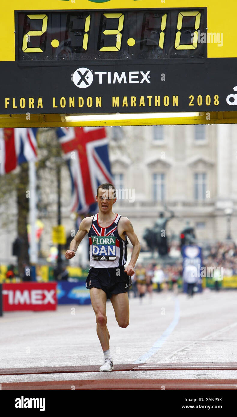 Flora London Marathon. British runner Dan Robinson crosses the finish ...