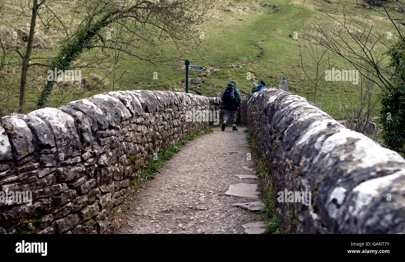 The footbridge at Milldale over the river Dove in Dovedale in the ...