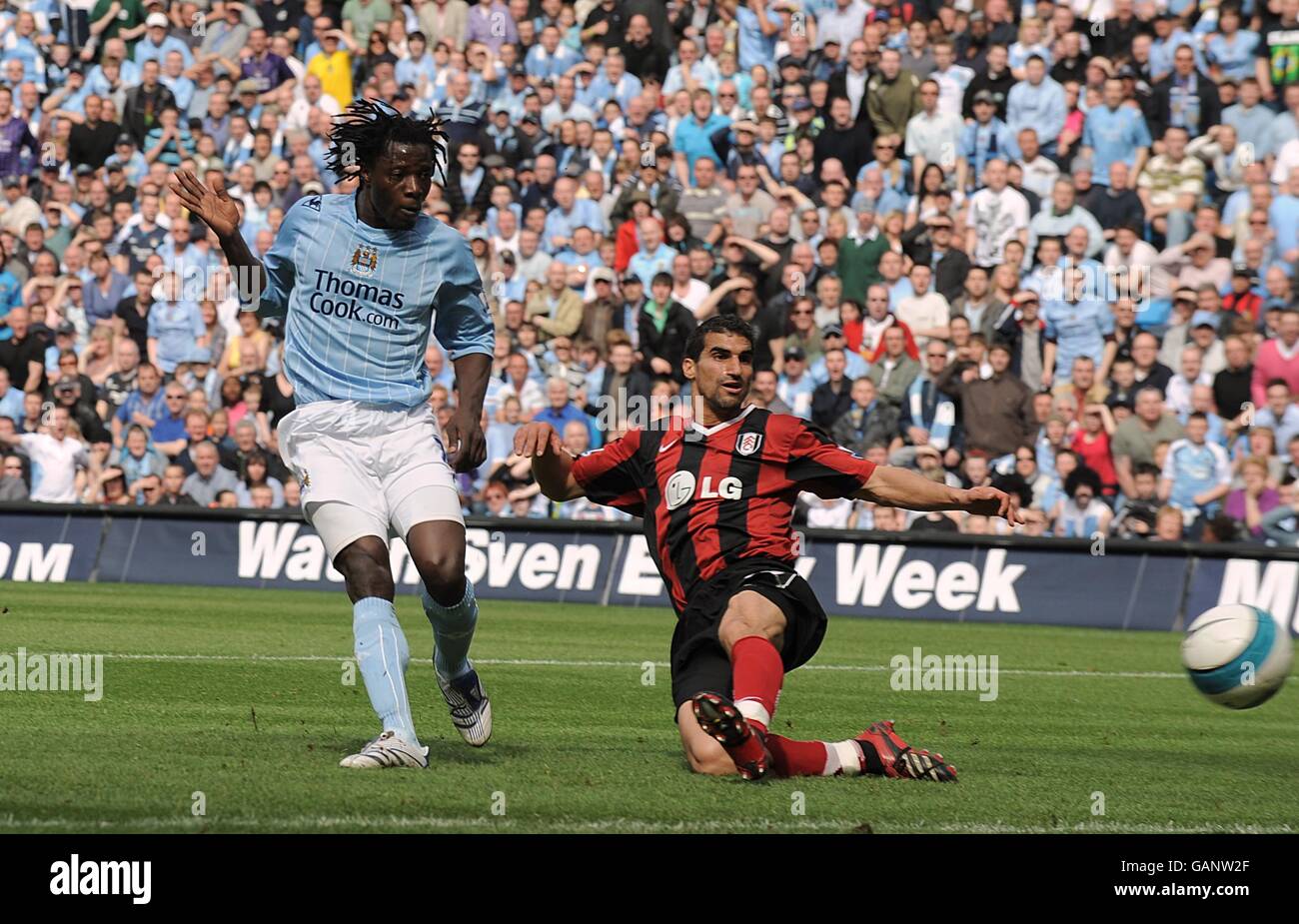 Manchester City's Benjani Mwaruwari (left) scores his sides second goal ...