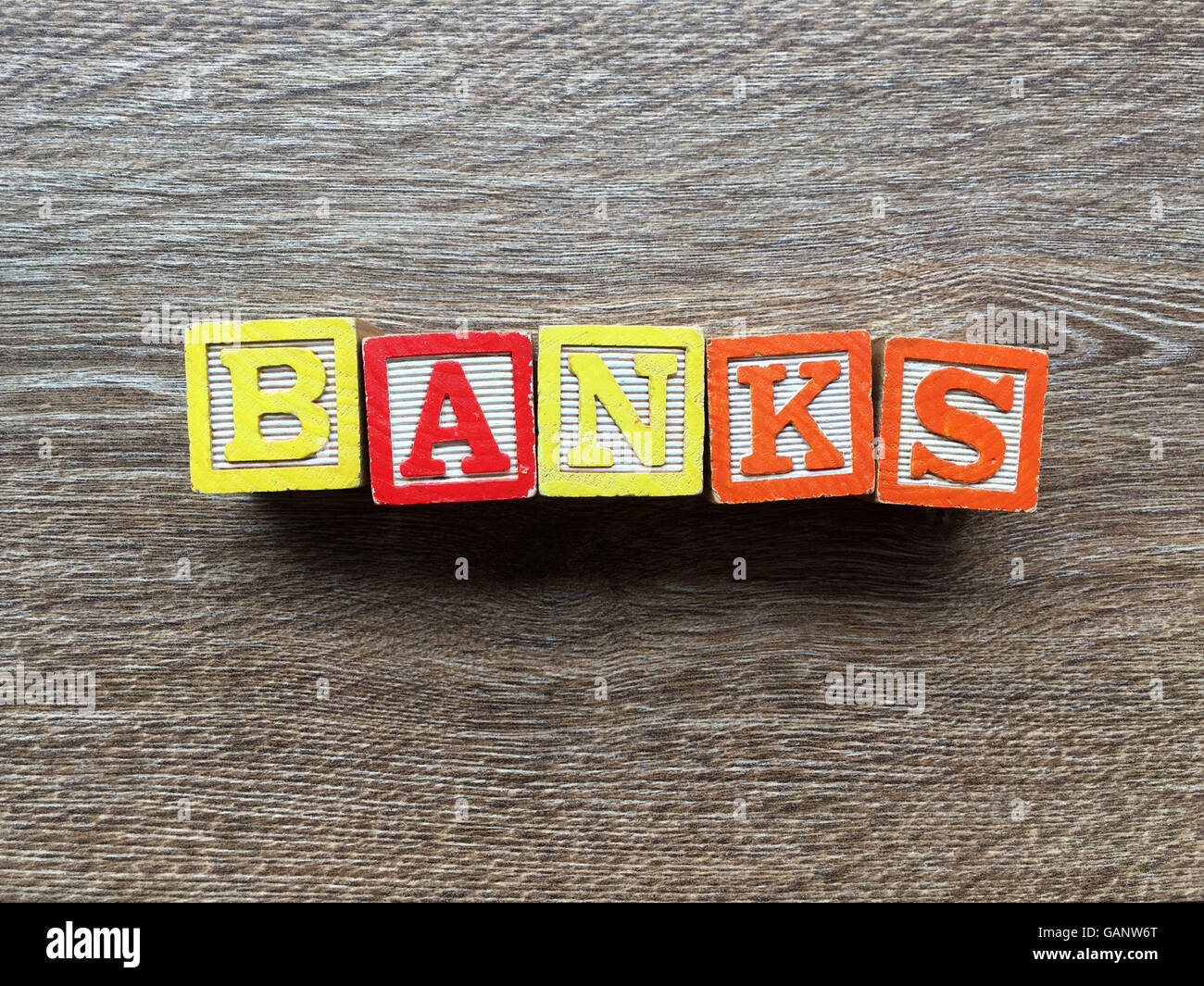 BANKS word made with toy wood blocks letters Stock Photo - Alamy