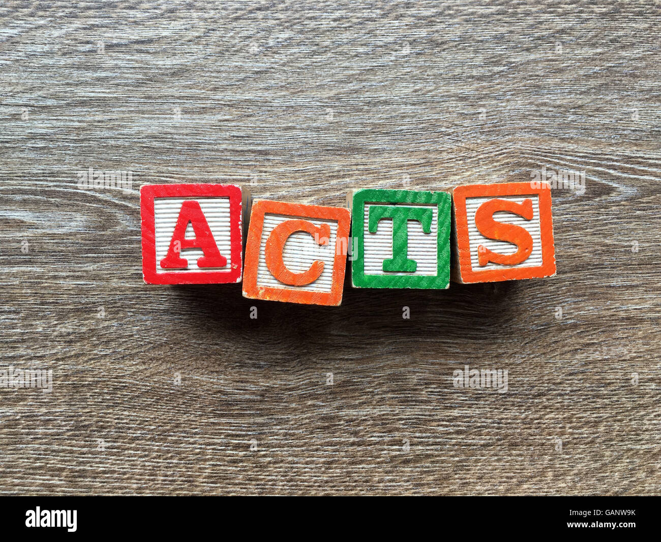 ACTS word made with toy wood blocks letters Stock Photo - Alamy