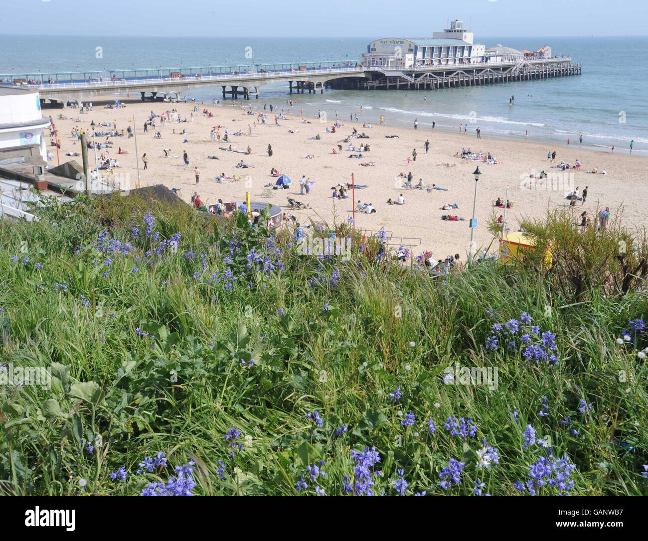 People enjoying the fine weather on a beach in Bournemouth today Stock ...
