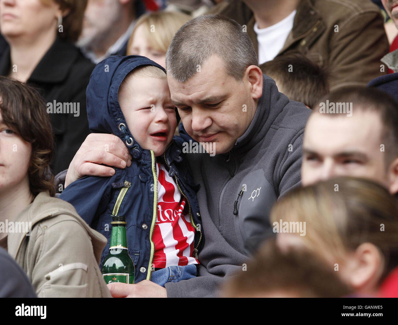 Stoke City fans react watching on a big screen at the Britannia Stadium ...