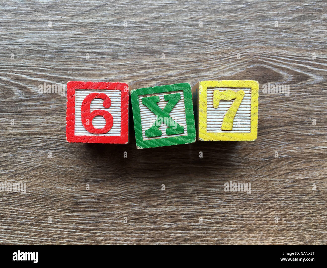 6x7 Multiplication done with wood blocks numbers Stock Photo - Alamy