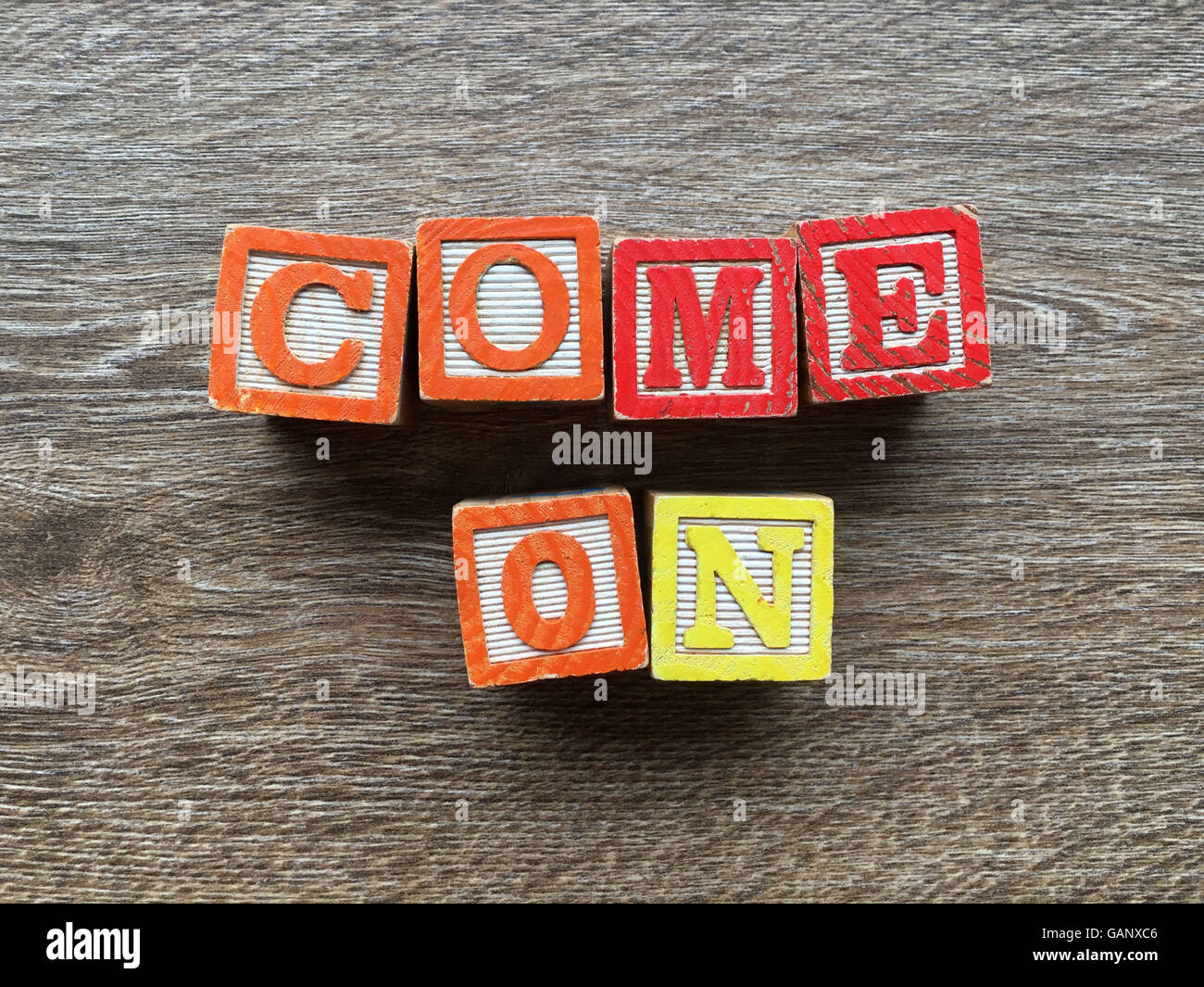 COME ON made with toy wood blocks letters Stock Photo - Alamy