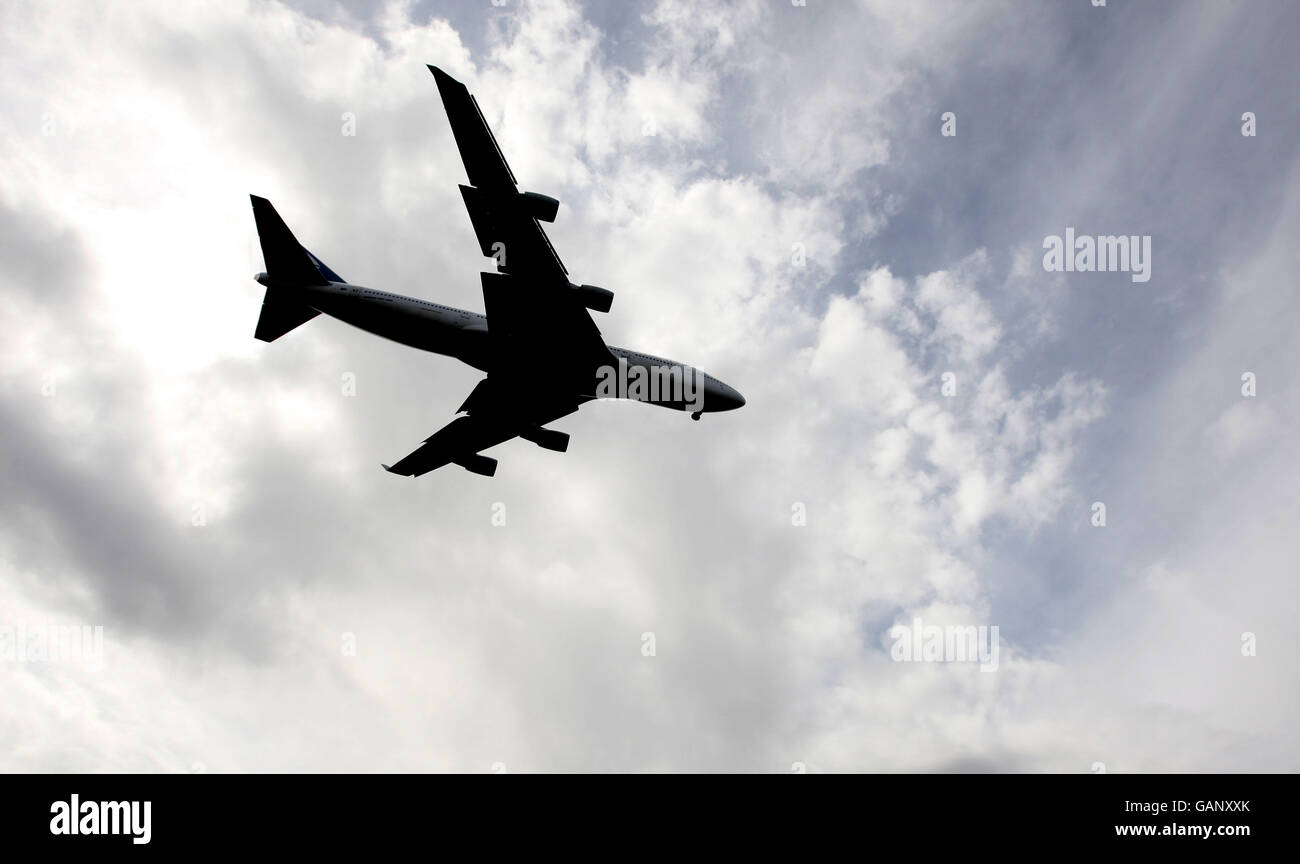 A generic photograph of a plane flying low over a local housing estate ...