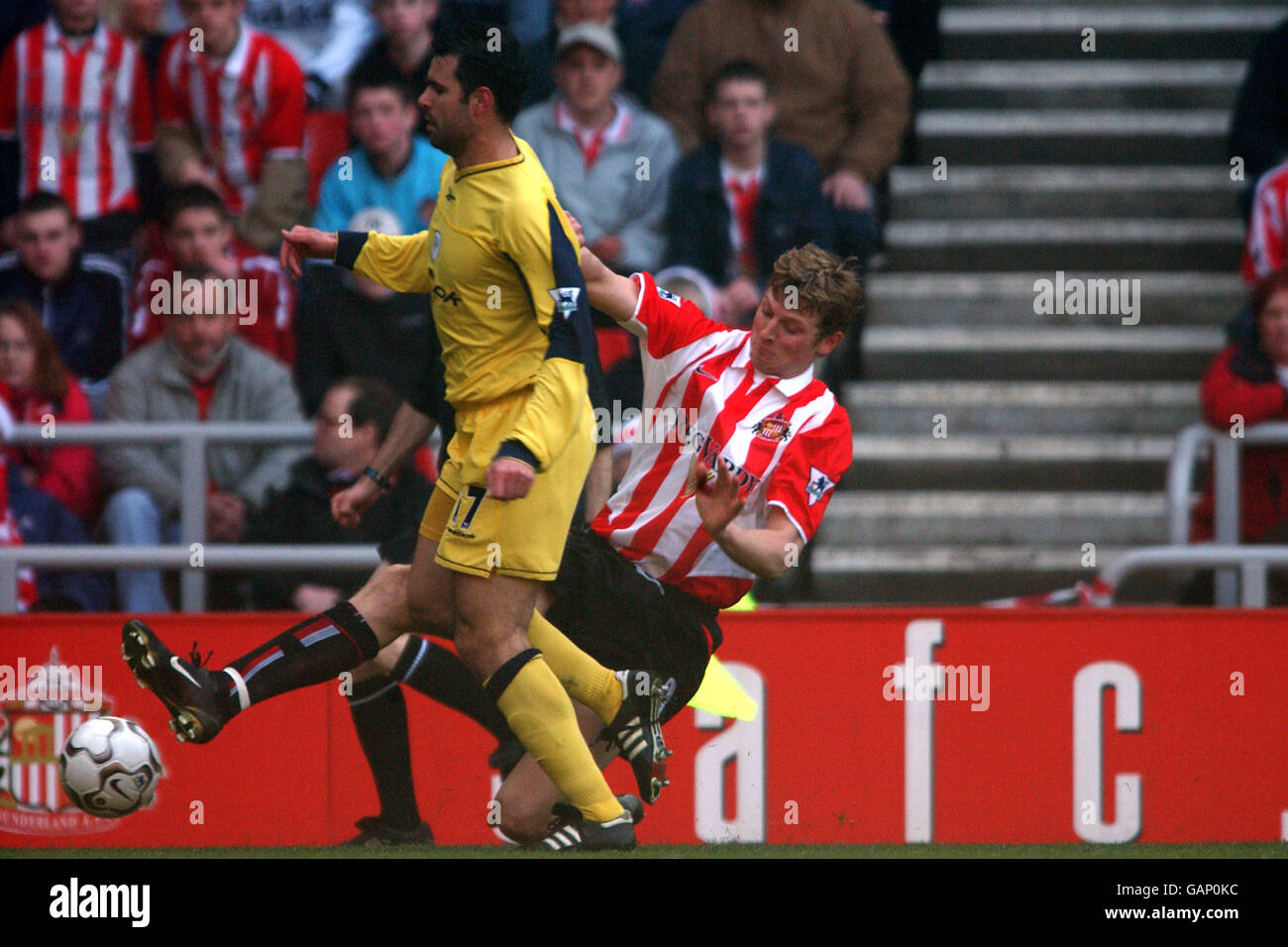 Sunderland's Tore Andre Flo (r) challenges Bolton Wanderers' Florent ...