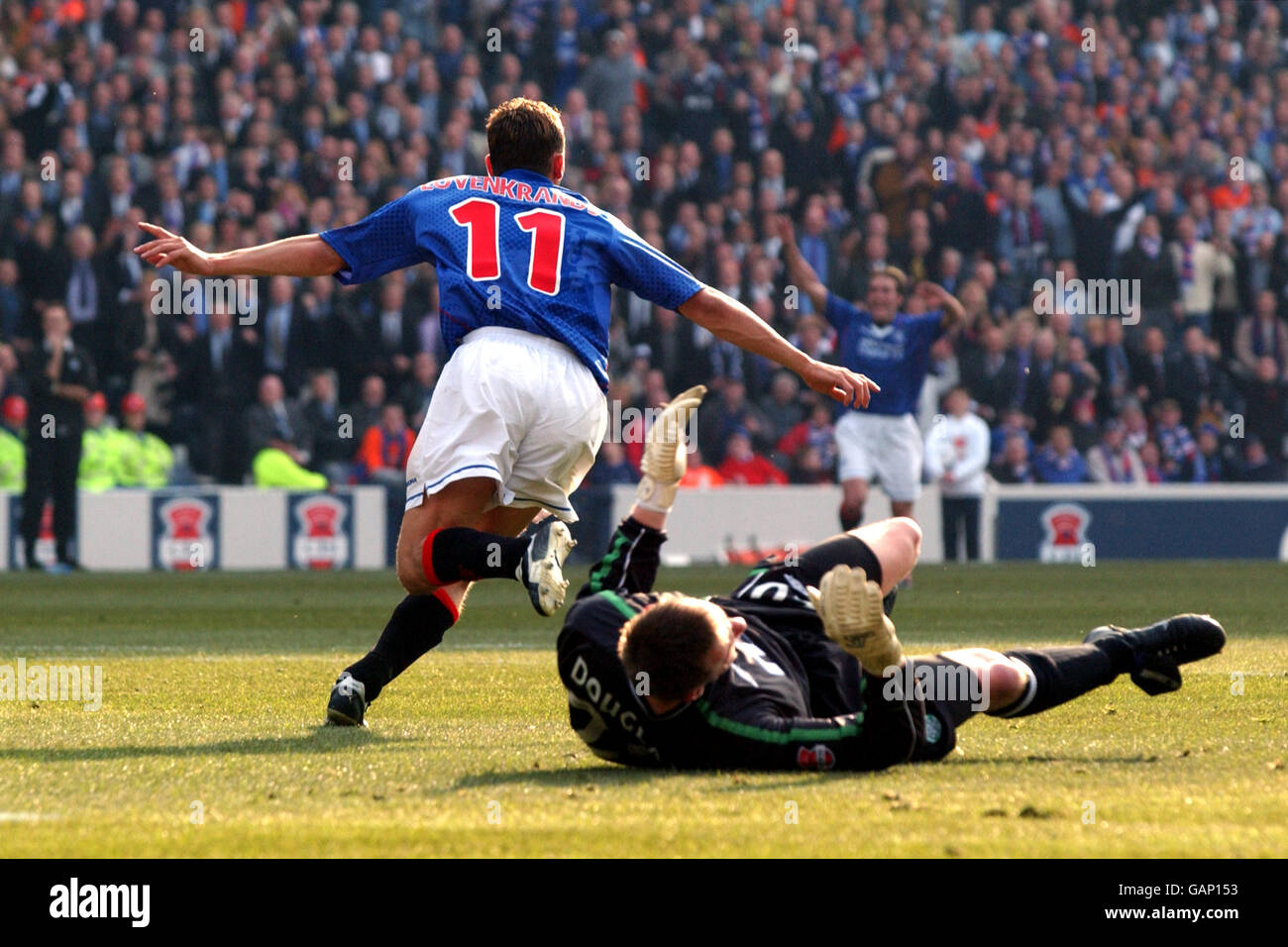 Rangers' Peter Lovenkrands (l) celebrates after scoring the second goal ...