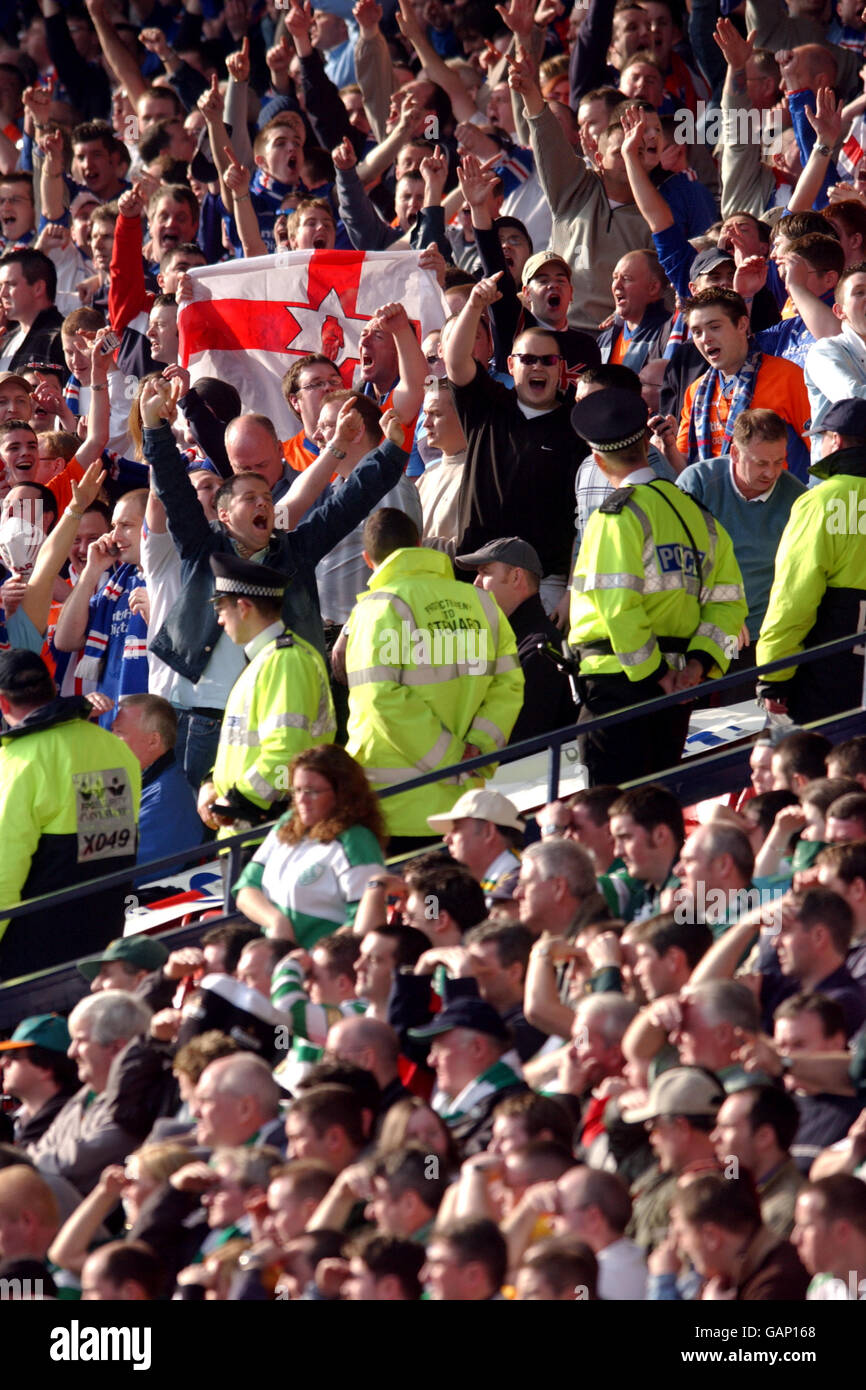 Police stand between the jeering Rangers fans and Celtic fans Stock ...