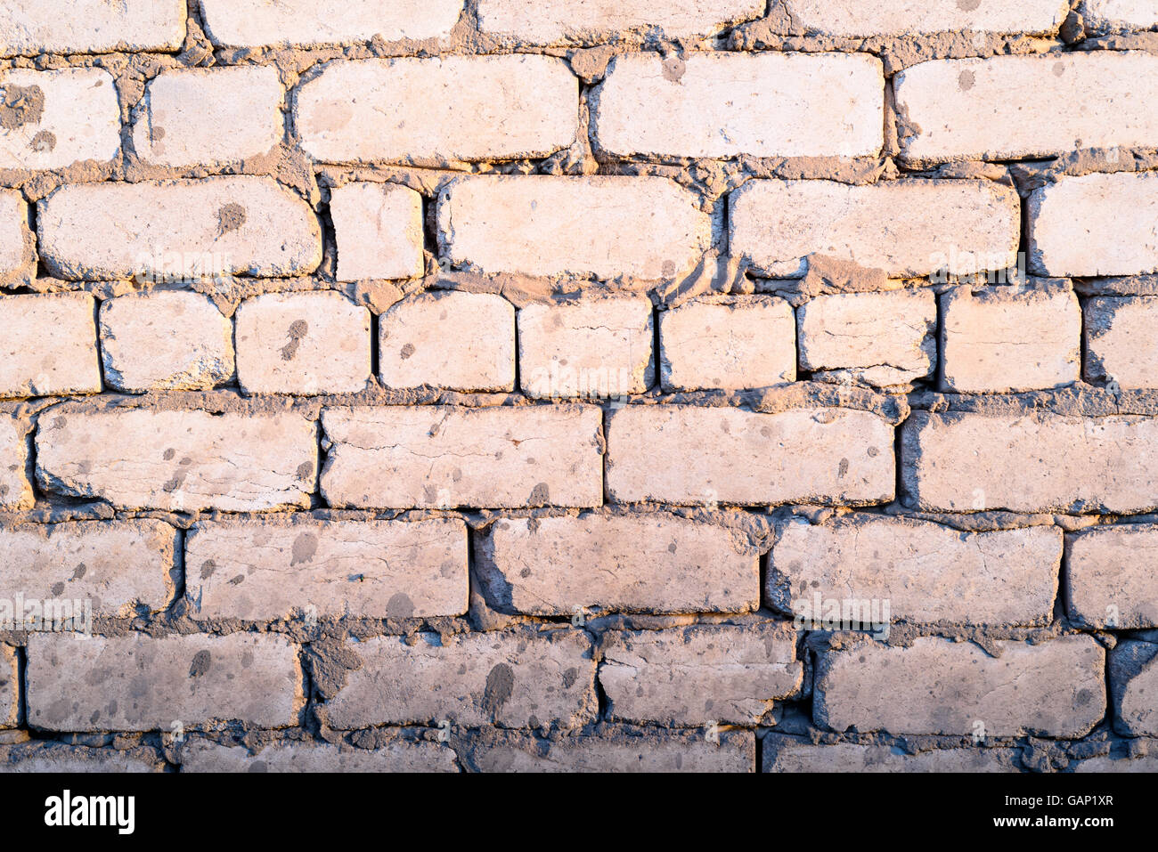Old faded home brick wall in natural sunlight with copyspace area Stock ...
