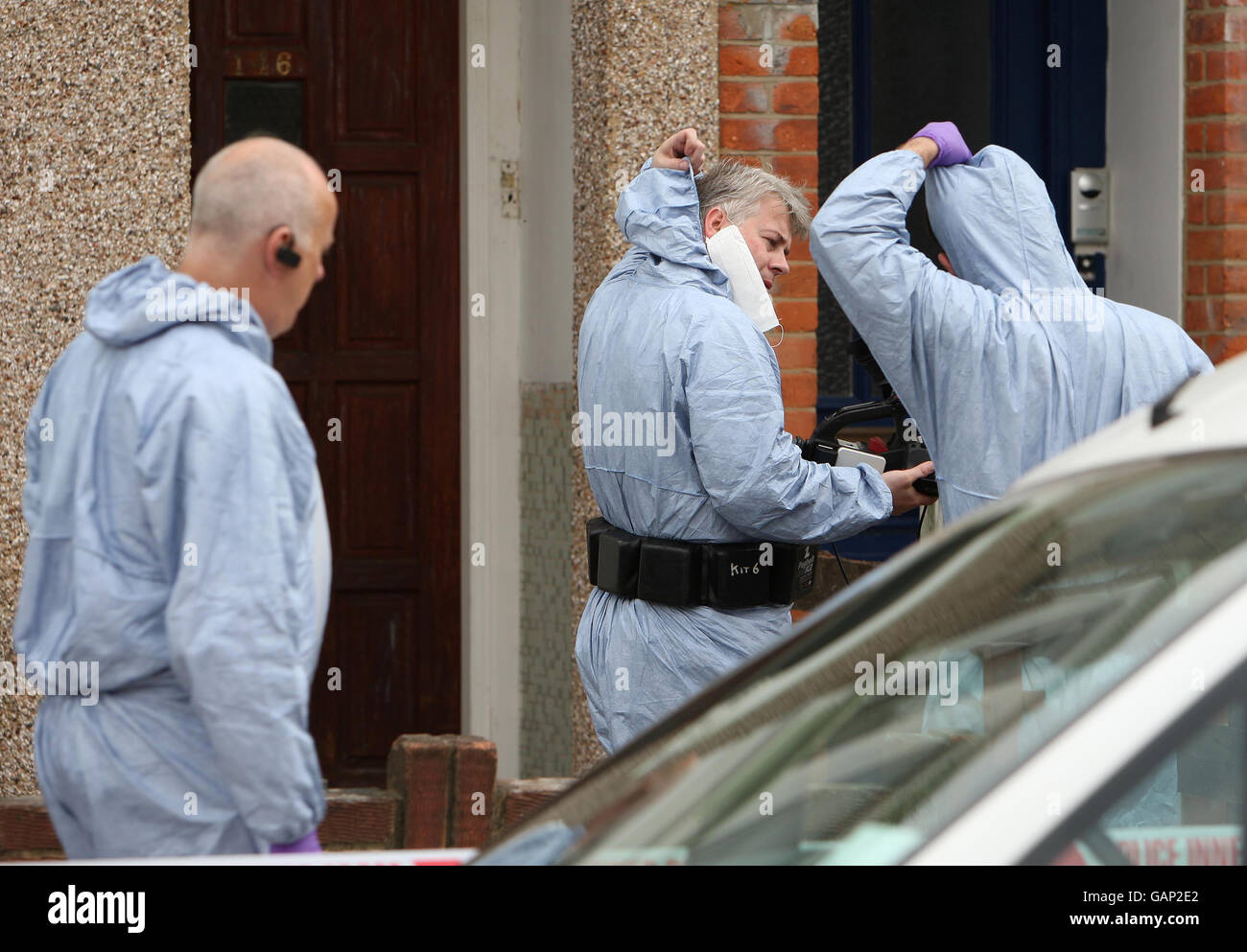 Police forensic scientists work outside 146 Station Road, Finchley ...