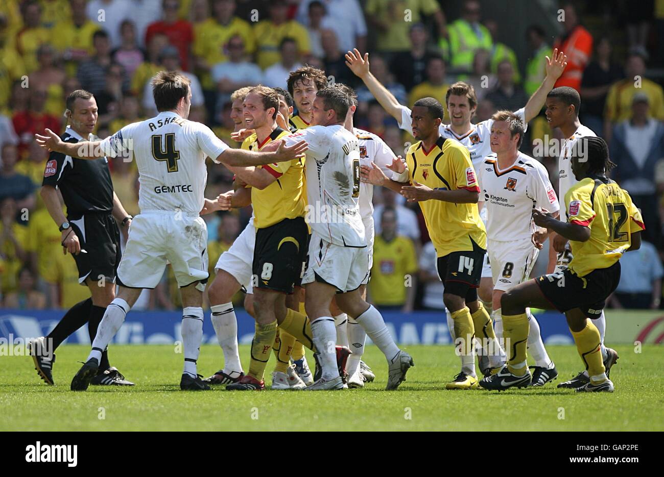 Watford's John Eustace (left from centre) has words with Hull City's ...