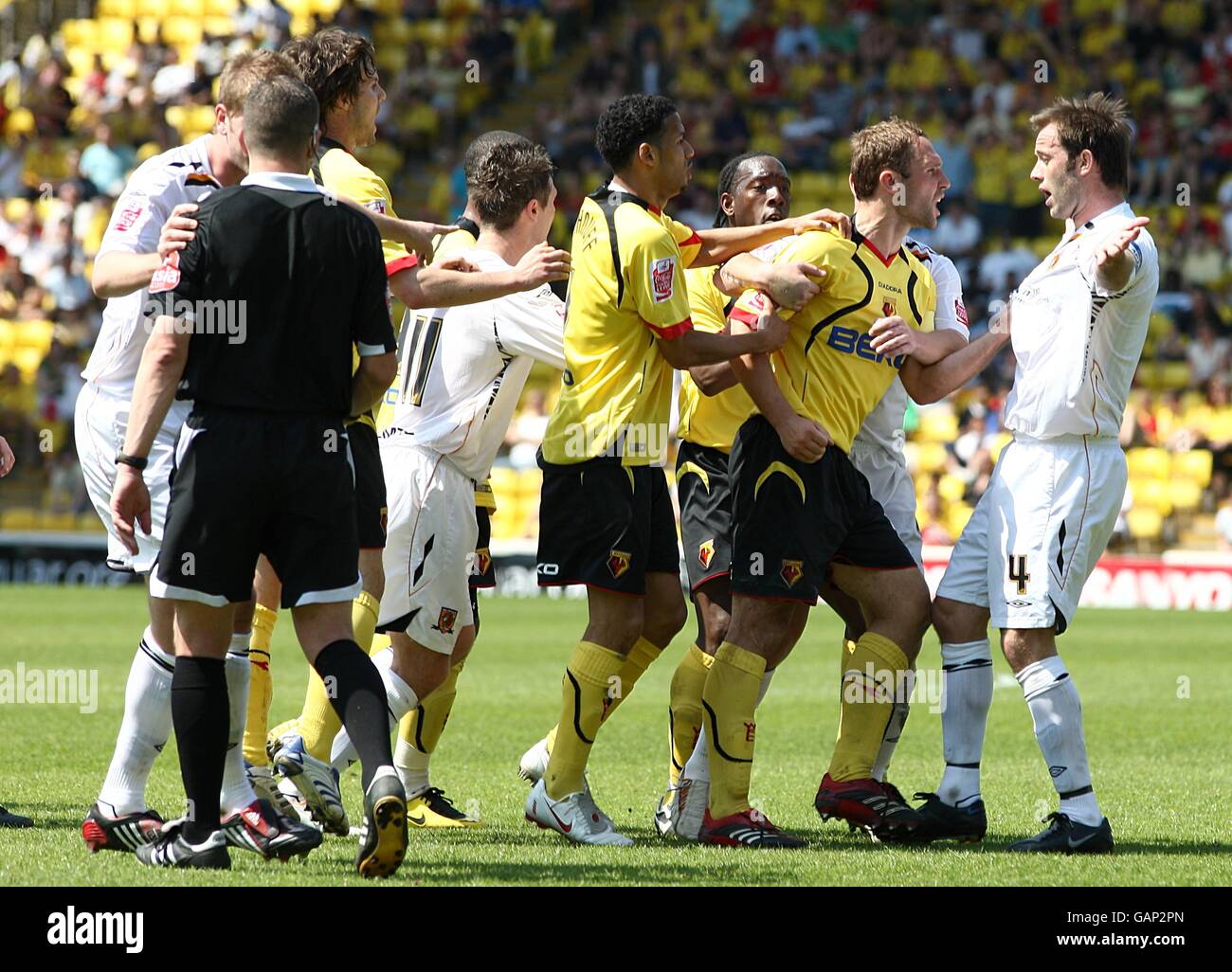 Watford's John Eustace (2nd r) squares up to Hull City's Ian Ashbee ...