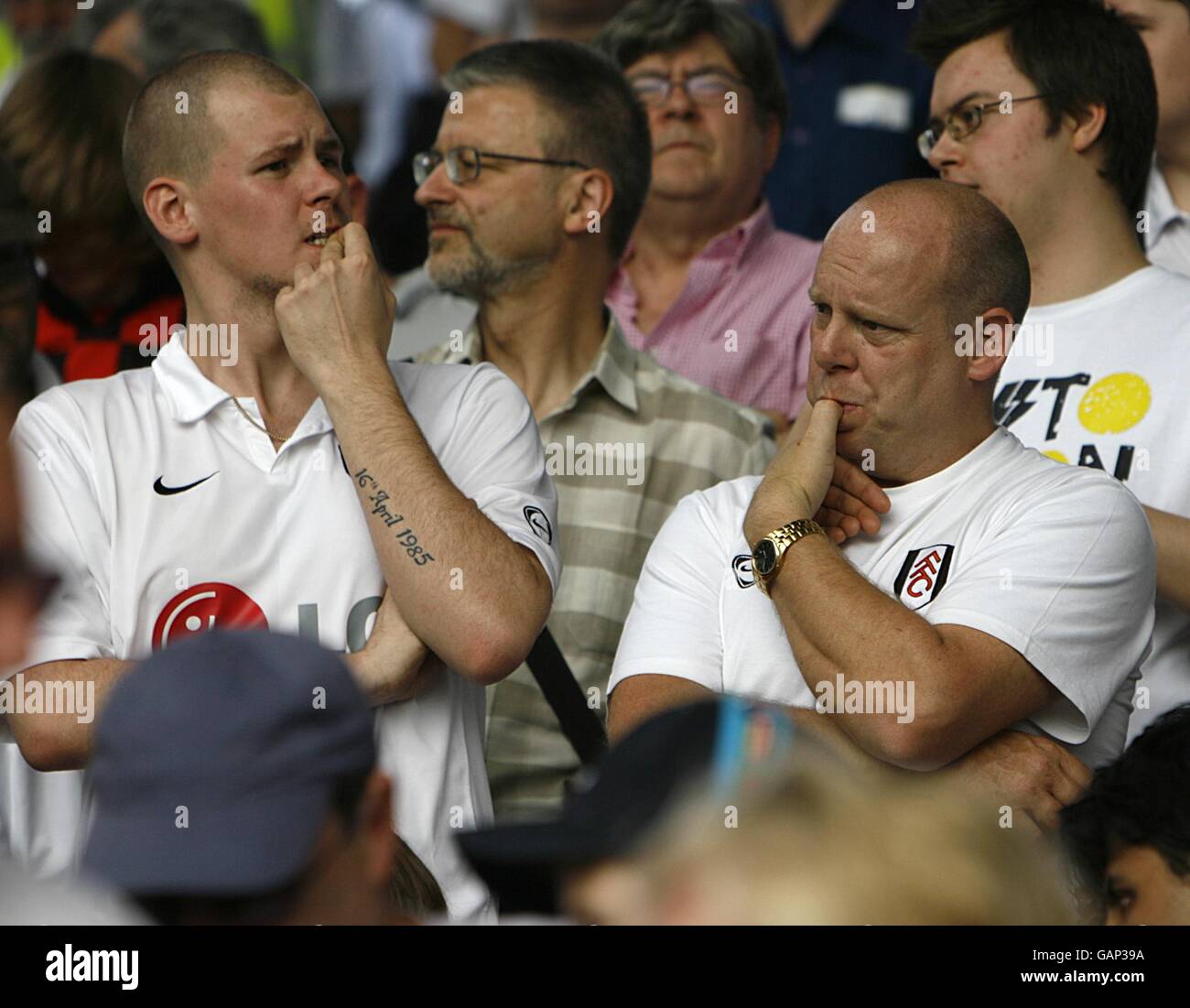 Fulham fans look on nervously at half time as they face relegation on ...