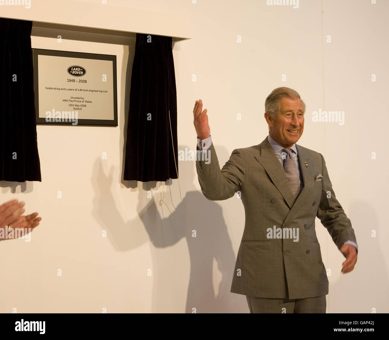 The Prince of Wales unveils a plaque during a visit to celebrate the ...