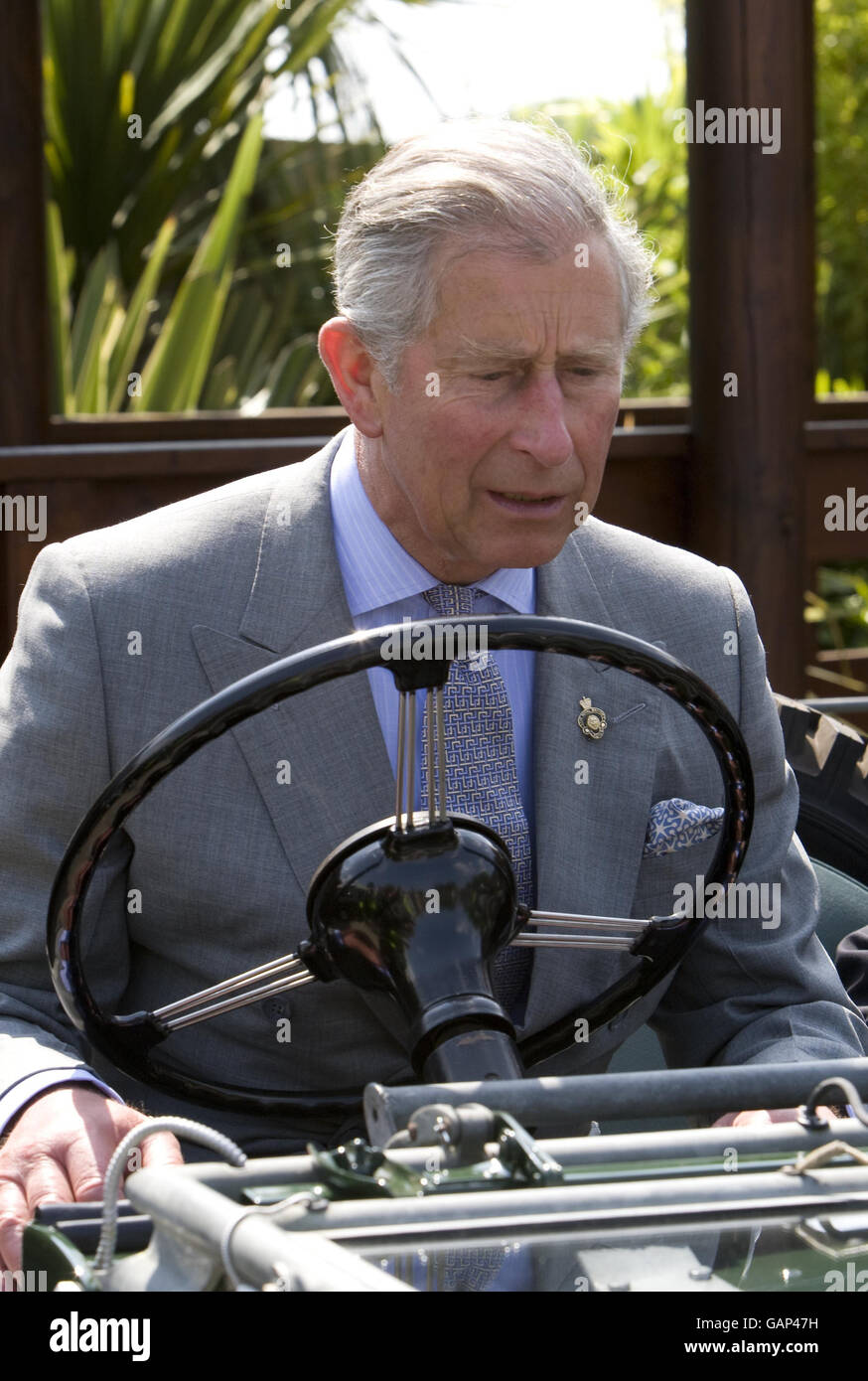 The Prince of Wales sits in a 1948 open Land Rover during a visit to ...